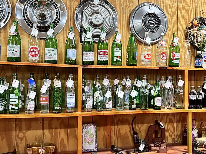 Vintage soda bottles and hubcaps create an unexpected symphony of Americana – the kind of display that stops you mid-aisle.