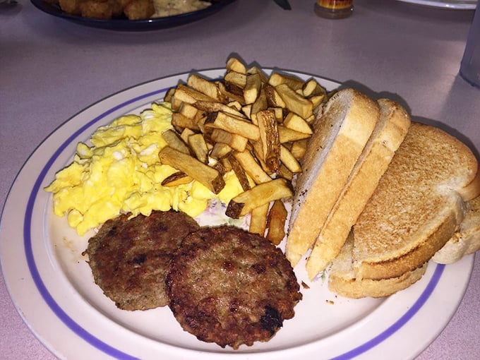 The breakfast platter that answers all of life's important questions. Eggs, home fries, sausage patties, and toast—a complete breakfast philosophy.