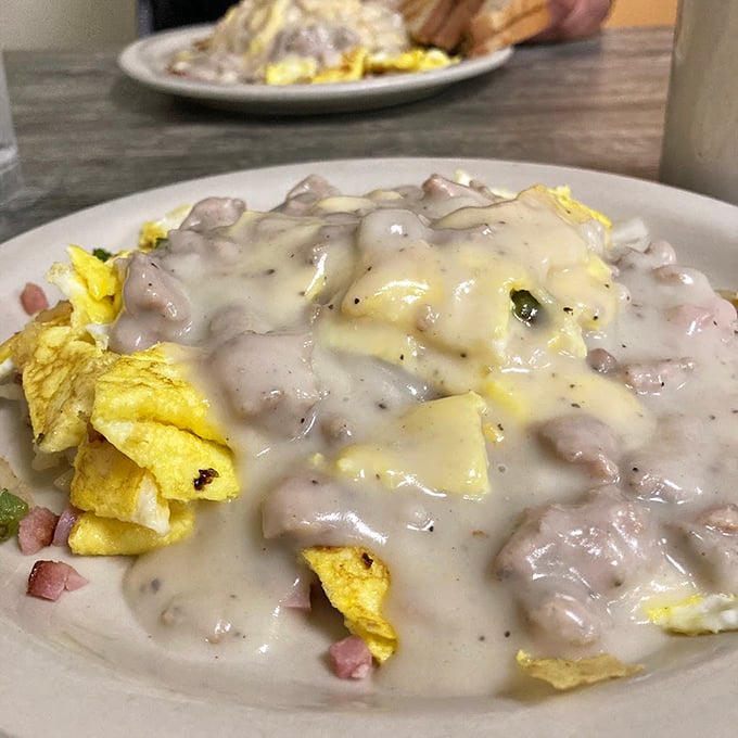 Biscuits and gravy that could make a grown man weep – breakfast doesn't get more comforting than this creamy, savory masterpiece.