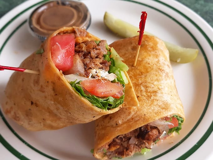 This wrap isn't just lunch—it's a portable feast of fresh ingredients bundled together with the precision of an expert gift-wrapper.