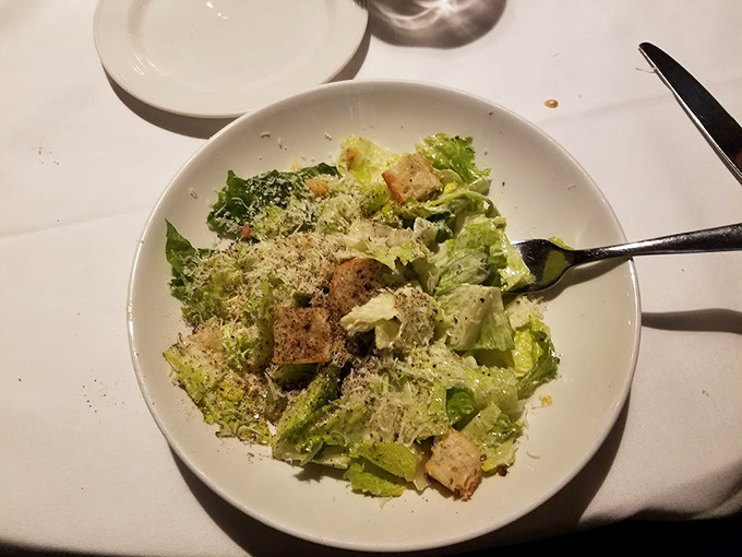 A Caesar salad that reminds you vegetables can be more than an obligation—crisp, perfectly dressed, with croutons that actually deserve their place.