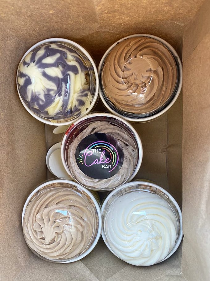 Five cups of frosting perfection, boxed and ready for transport. Like the United Nations of dessert, bringing different flavors together in harmony.