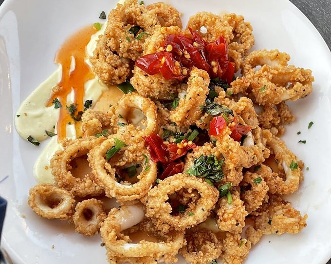 Calamari that defies the rubbery reputation of lesser versions. These golden rings are tender enough to cut with a fork—if you can resist using your fingers.