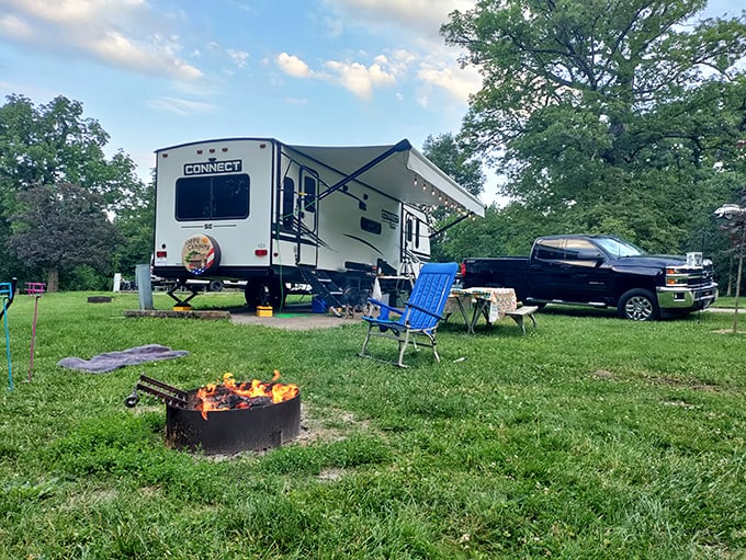 Camping's greatest luxury isn't inside that trailer—it's the crackling fire, open sky, and permission to do absolutely nothing.
