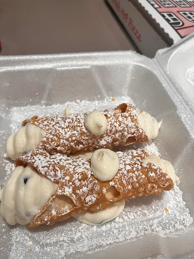 Cannoli that would make your Italian grandmother nod in approval. Crisp shells, creamy filling, and a dusting of powdered sugar—simple perfection.