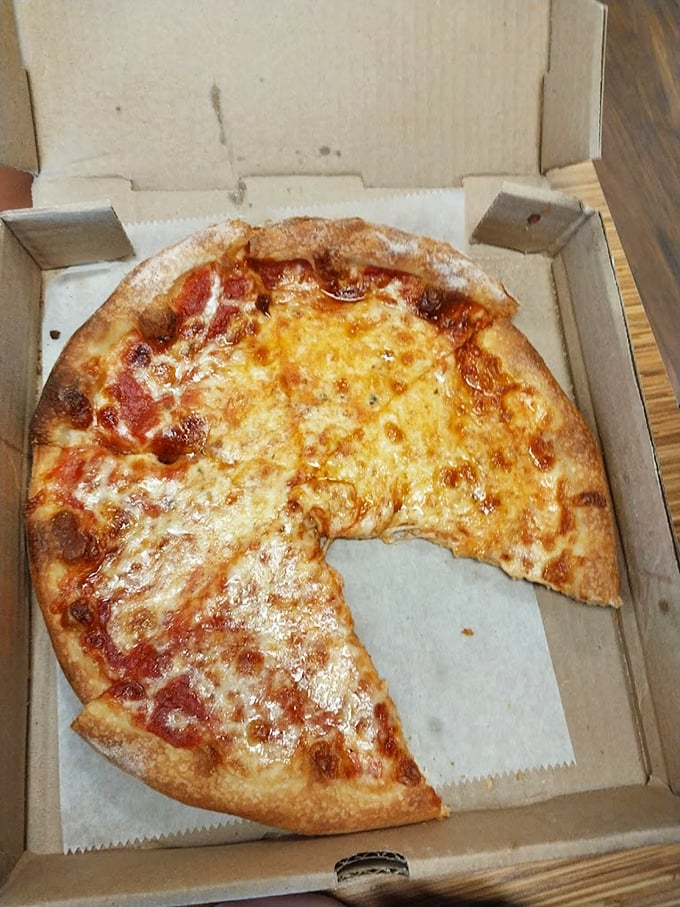 The classic cheese pizza—deceptively simple, yet the true benchmark of any pizzeria's quality. This one's passing with flying colors.