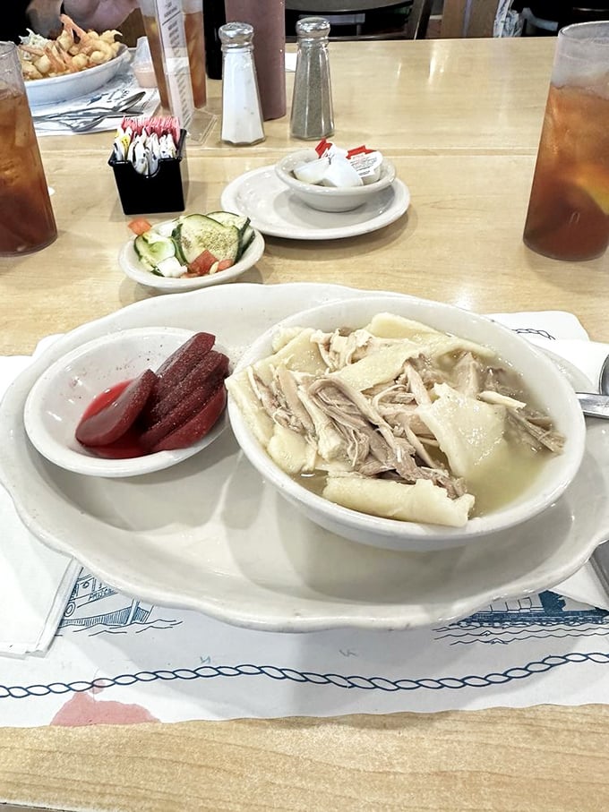 Chicken and dumplings with pickled beets on the side—proof that O'Steen's knows there's more to life than just seafood.