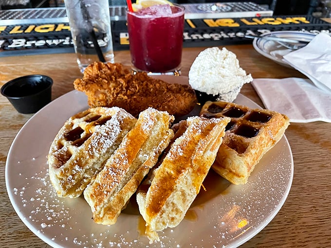 Chicken and waffles: the culinary equivalent of a perfect marriage. The powdered sugar dusting adds that touch of sweetness that ties everything together.