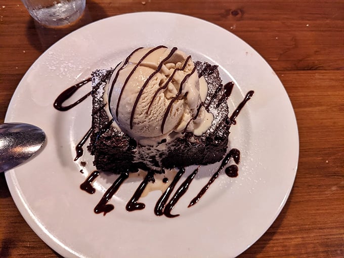 The brownie à la mode – a study in contrasts where warm chocolate decadence meets cold vanilla creaminess in a dessert that's worth every calorie.