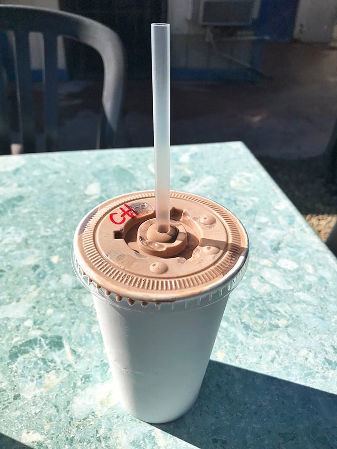 A chocolate shake so thick it's practically weight training for your straw. The perfect cool counterpoint to the savory delights on the menu.