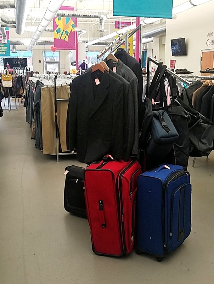Business up top with suits and blazers, party on the bottom with colorful luggage—the mullet philosophy of thrift store organization.