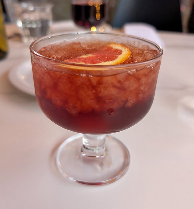 A cocktail that looks like it's wearing its Sunday best. That grapefruit slice isn't just garnish—it's making a statement.
