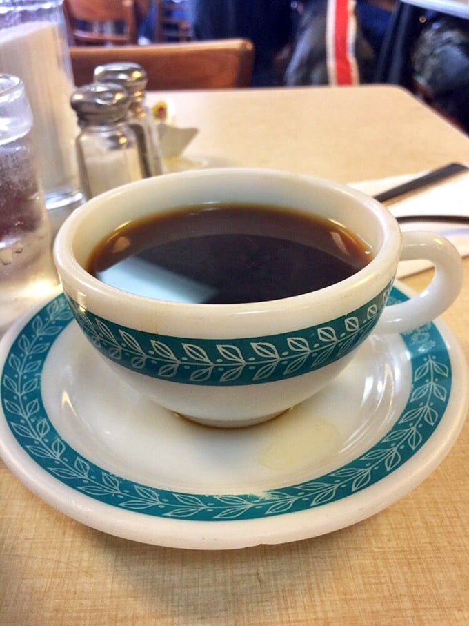 Coffee served in that iconic blue-patterned diner china—the perfect bitter companion to cut through the richness of your seafood feast.