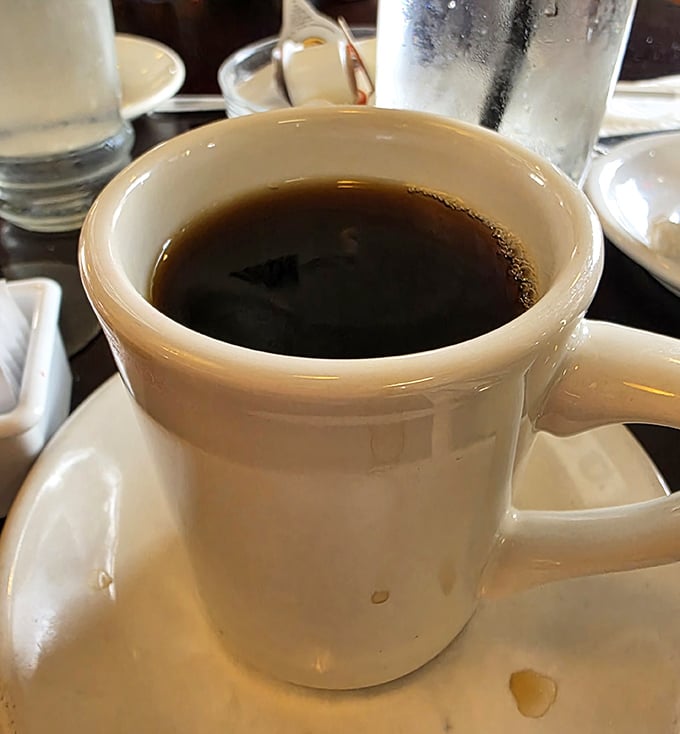 The lifeblood of breakfast enthusiasts everywhere—a sturdy mug of coffee that promises to transform morning zombies into functioning humans.