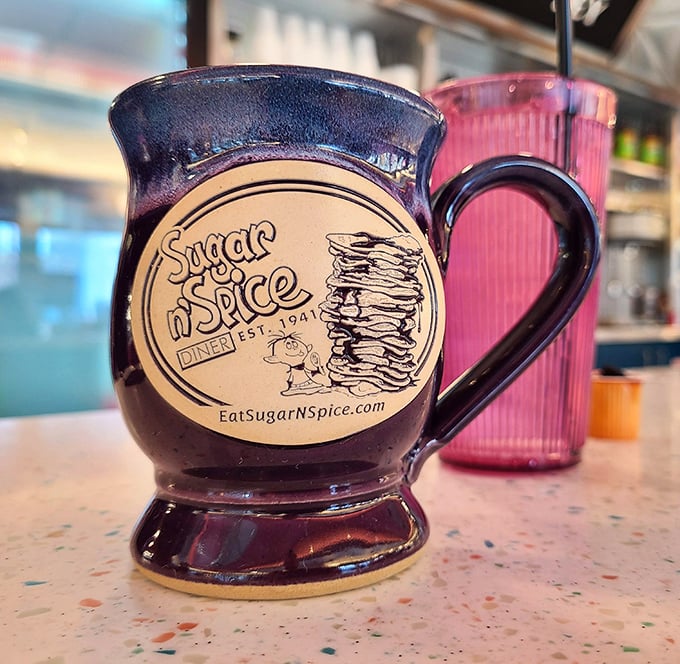 The coffee mug that promises liquid salvation – sturdy enough to withstand multiple refills during epic breakfast debates.