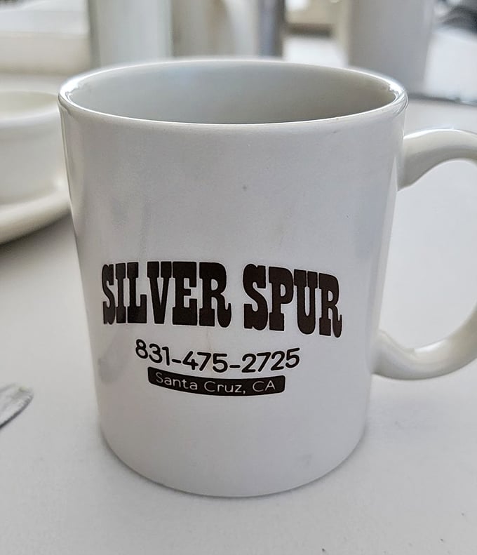 A simple white mug that promises infinite refills of liquid motivation—the unsung hero of every great breakfast experience.