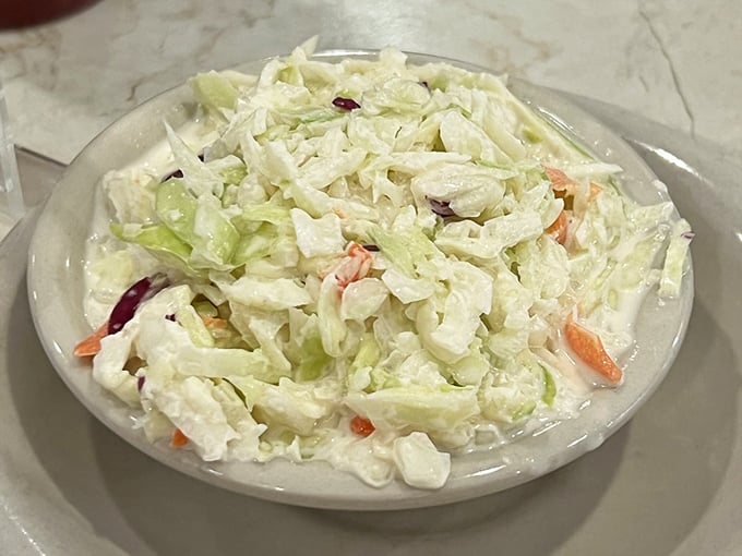 This isn't just coleslaw—it's the cool, creamy counterpoint to all that fried goodness. The vegetable that earned its place at the seafood table.
