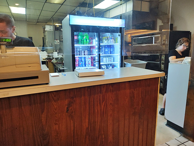 Behind every great Italian restaurant is a counter like this—part command center, part gateway to happiness. The refrigerator in back holds liquid reinforcements.