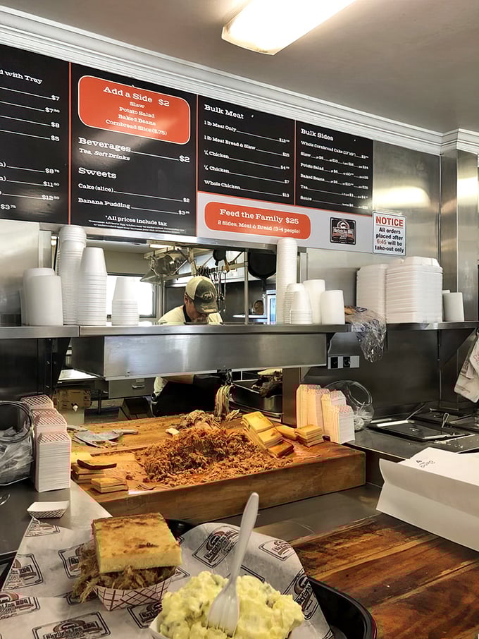 Behind the counter is where the magic happens—wood-chopped pork on display like the culinary treasure it is, ready for its close-up and your appetite.