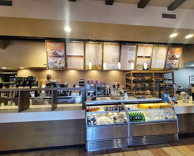 Where the magic happens—pastries tempt from behind glass while the menu boards above promise satisfaction for whatever craving strikes.
