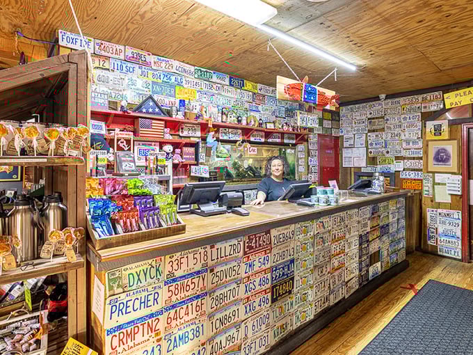 The license plate-covered counter isn't trendy décor—it's a visual guestbook of visitors who've made the pilgrimage for perfect catfish.
