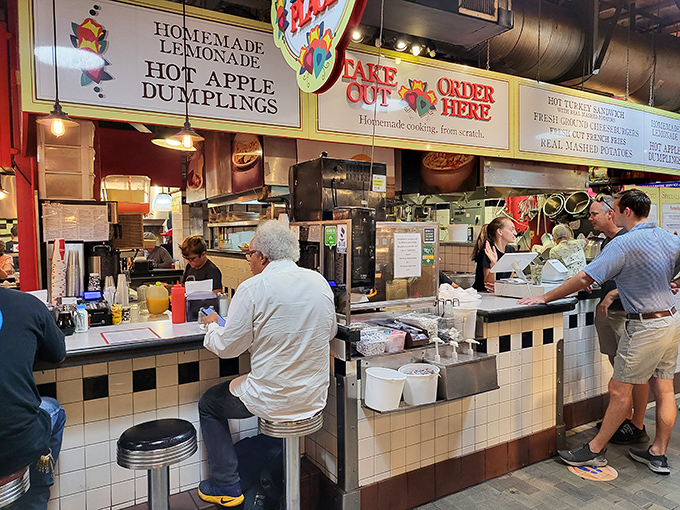 The counter service setup showcases efficiency in motion—staff working with the choreographed precision of a well-rehearsed dance company.