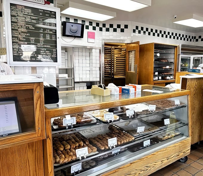 The glass case of temptation—where diet plans go to die and happiness is measured in inches of display space.