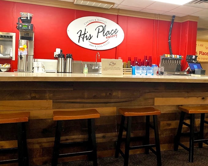 The counter area's rustic wood and vibrant red wall create that perfect "come as you are" vibe that makes regulars out of first-timers.