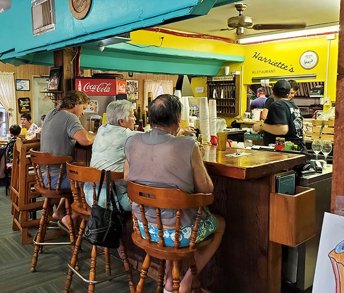 Counter dining at its finest—where locals share fishing tales and tourists become honorary residents over cups of steaming coffee and plates of comfort.