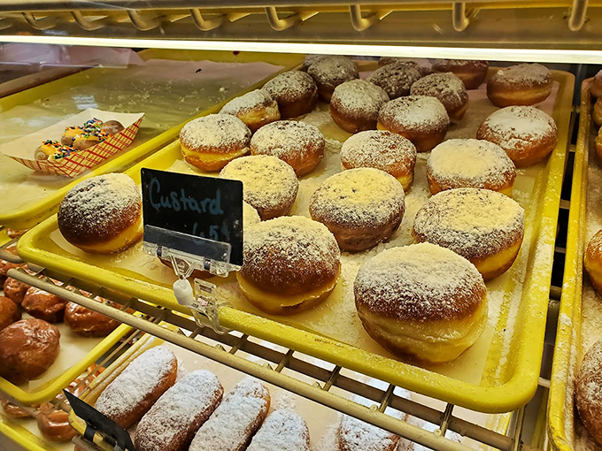 Custard-filled donuts dusted with powdered sugar – the kind that make you not care about the white evidence left on your shirt afterward.