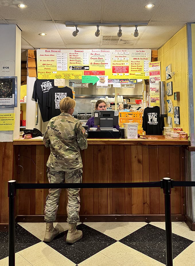 The ordering counter—where dreams become reality and decisions become delicious. Note the military customer, because good barbecue transcends all demographics.