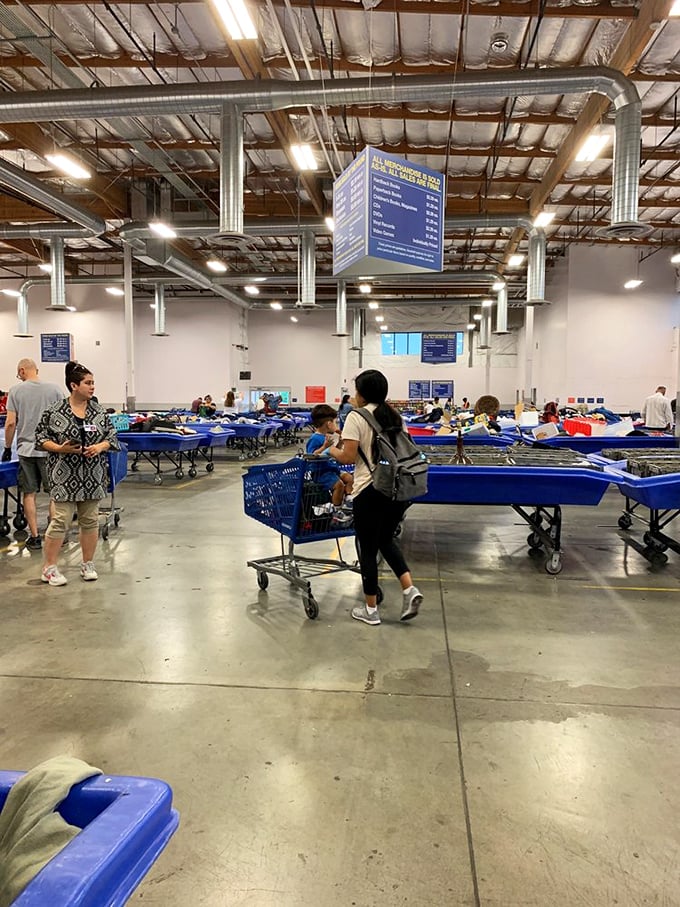 The dance of the bins—shoppers navigate the warehouse with practiced precision, carts at the ready for the next rotation.