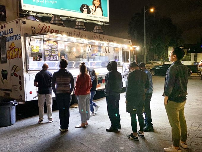 The line forms with patient anticipation—a diverse cross-section of LA united by the democratic appeal of exceptional tacos.