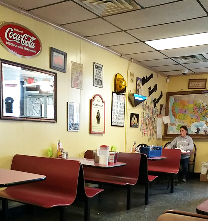 Red booths, Coca-Cola signs, and a map of America on the wall. This place is more patriotic than flag shorts on the Fourth of July.