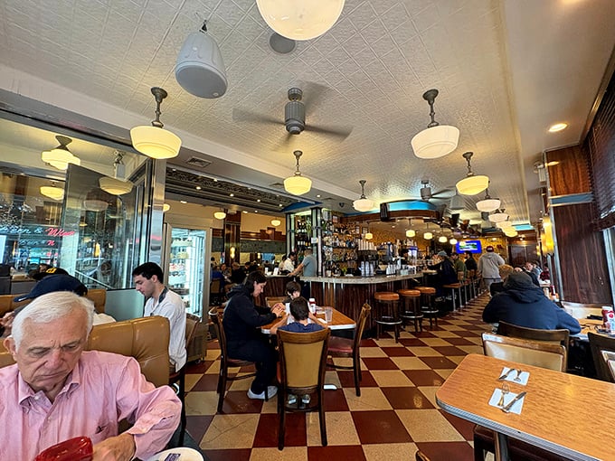 Where strangers become temporary neighbors over pancakes and coffee, sharing nothing but space and the universal language of "pass the syrup."