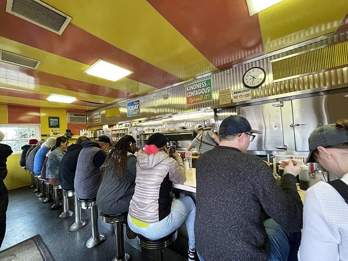 The counter on a busy morning—where strangers become neighbors and everyone has an opinion on everything from politics to pancakes.