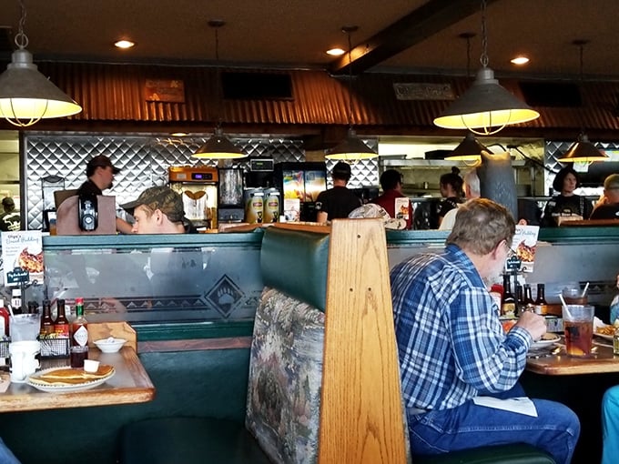 Where strangers become temporary neighbors, sharing nothing but space and the universal language of "mmm" that transcends all conversational barriers.