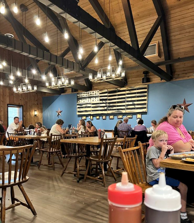 Where barbecue brings families together – wooden chairs, American flag décor, and sauce bottles standing ready for the serious business of eating.