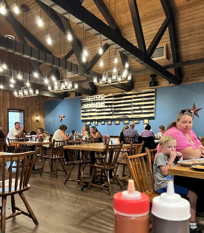 Where barbecue brings families together – wooden chairs, American flag décor, and sauce bottles standing ready for the serious business of eating.