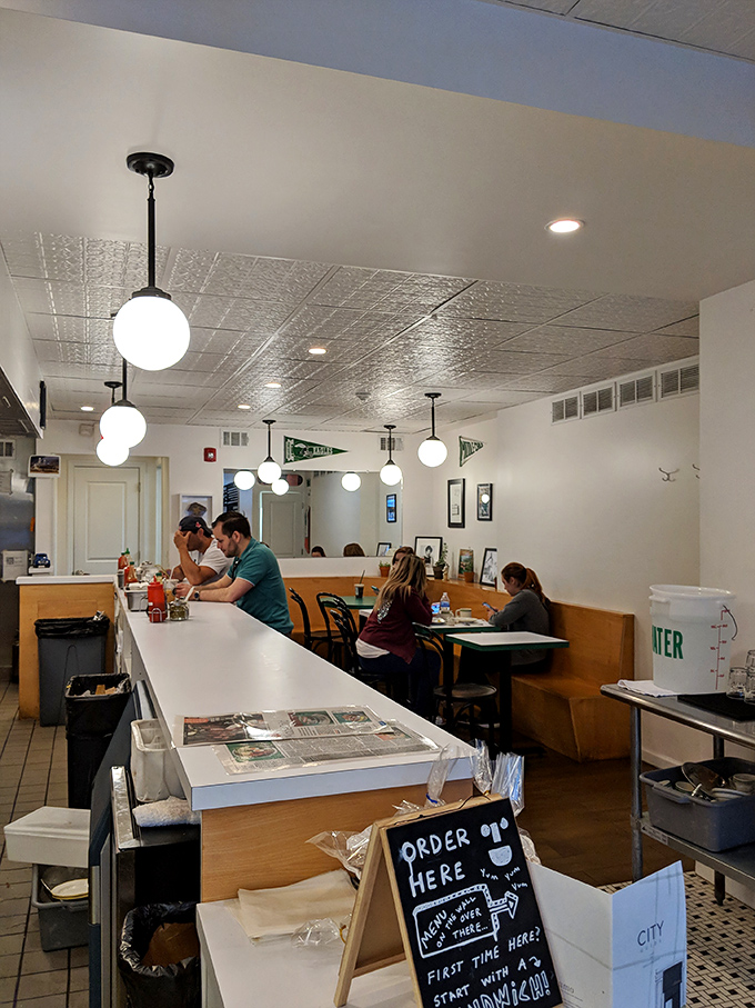 Where sandwich magic happens—diners at the counter get front-row seats to the culinary choreography behind Middle Child's creations.
