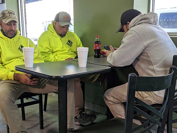 Working men taking a lunch break – in the universal language of sandwich appreciation, no translation is necessary.
