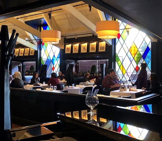 Those colorful stained glass windows transform ordinary light into something magical—just like what the kitchen does with ingredients.
