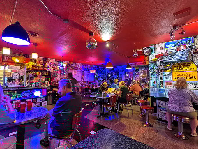 Where strangers become friends over shared tables and shared calories. The neon-bathed atmosphere makes everyone look like they're starring in their own diner documentary.