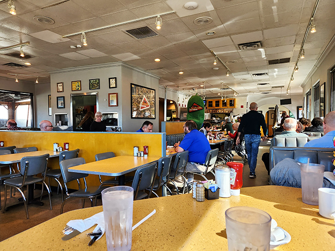 A bustling dining room where conversations flow as freely as the coffee, creating that perfect deli symphony of clinking dishes and laughter.