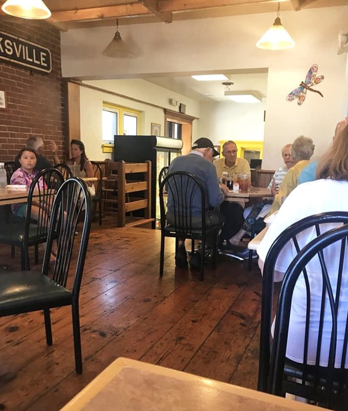 The dining room hums with conversation and coffee cups. Where locals and road-trippers unite in the pursuit of perfect pancakes.