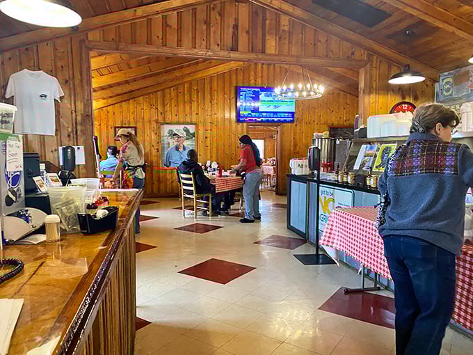 The dining room hums with conversation and anticipation. Those wooden chairs have supported generations of happy, sauce-stained diners.