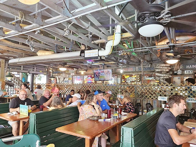 Where strangers become friends over cold drinks and seafood stories. The bar's weathered wood has heard every fish tale—some of them true.
