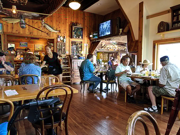 Where locals and visitors break bread together under watchful mounted fish. The warm wood interior makes everyone feel like they've come home.