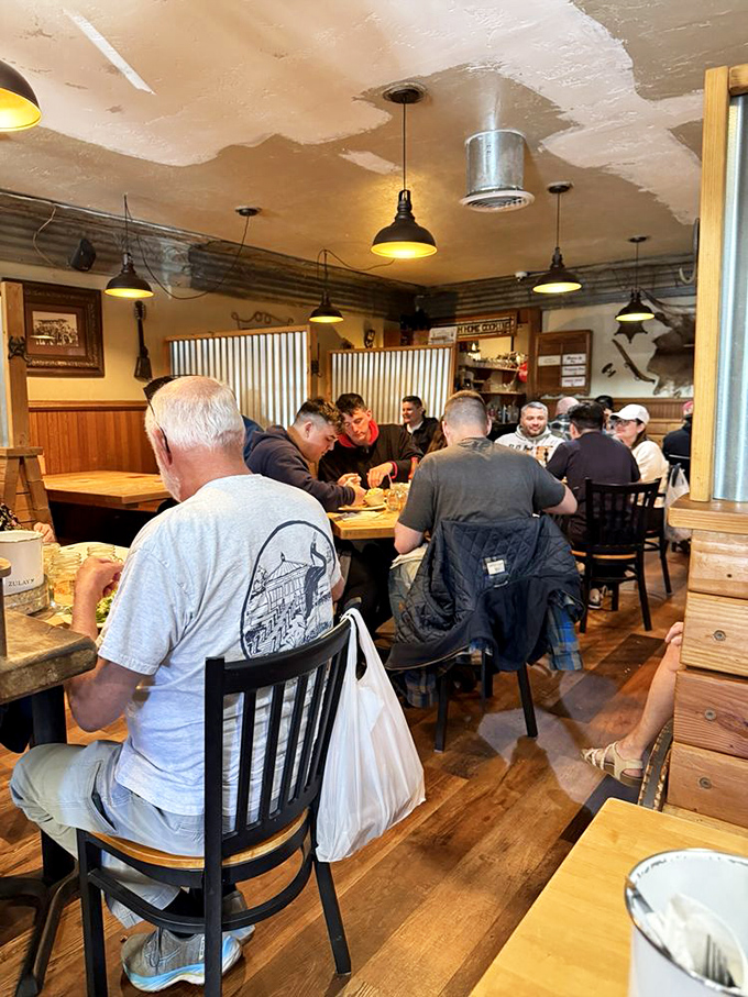 A bustling dining room where strangers become temporary friends, united by the universal language of good food.