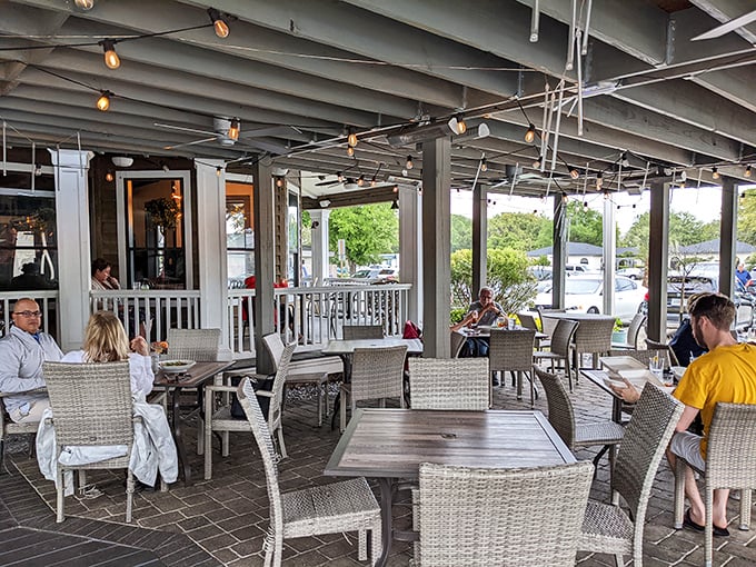Outdoor dining where gentle breezes complement every bite – nature's version of dinner and a show, Florida-style.